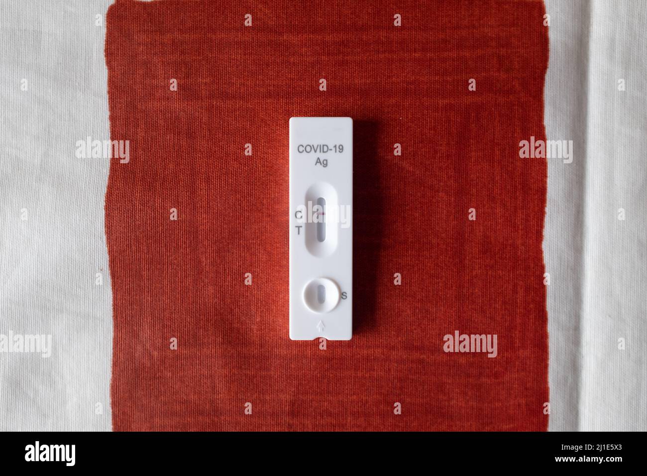 Positive Covid antigen test close up still on a red background Stock ...