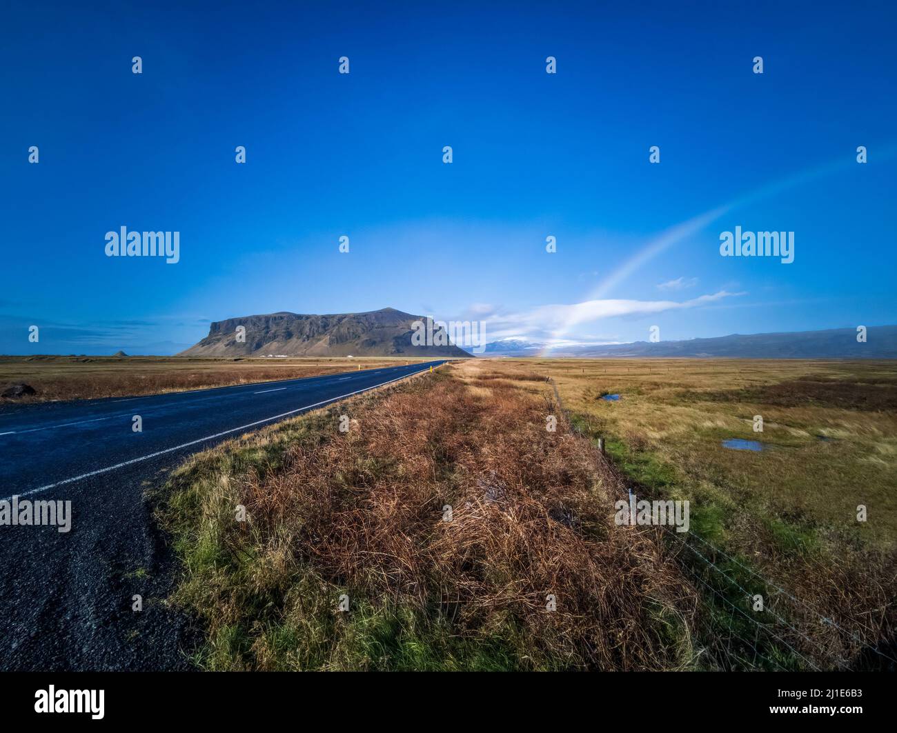 Blue sky under rainbow hi-res stock photography and images - Alamy
