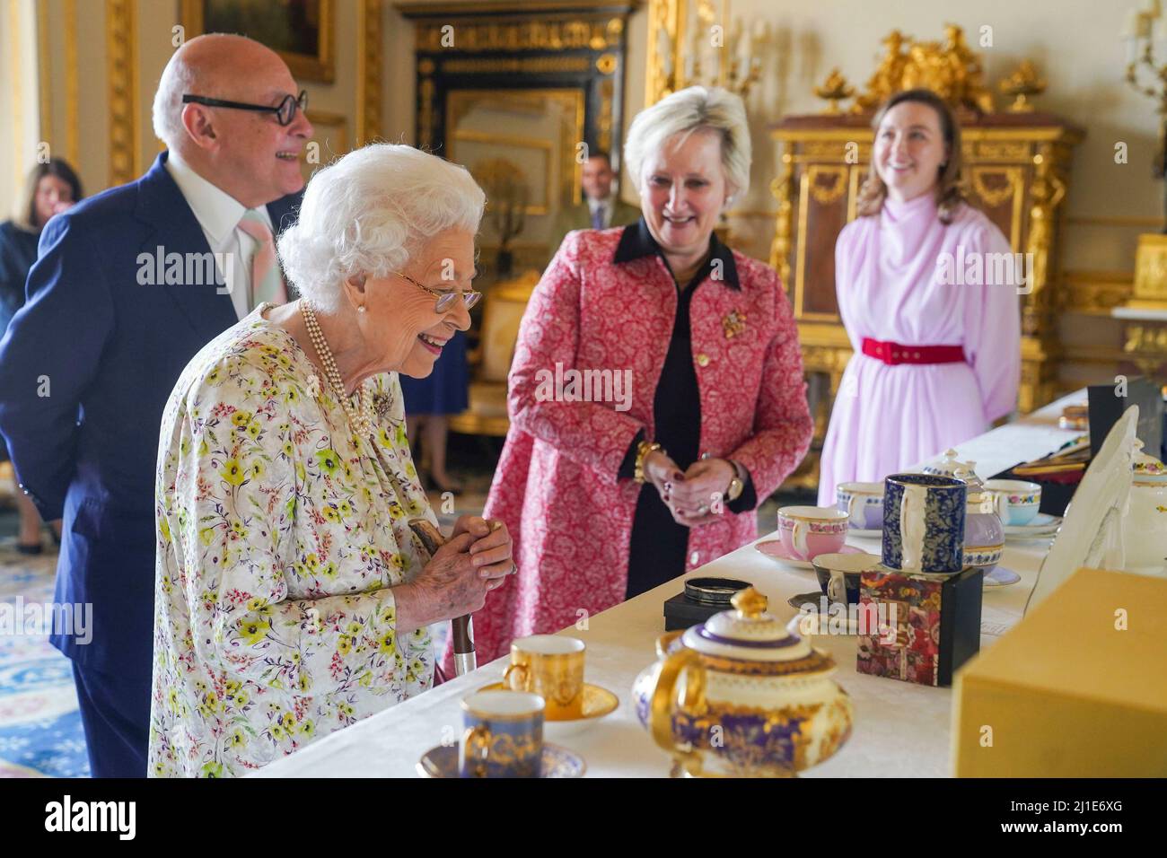 Queen Elizabeth II meets Pamela Harper (centre) and Dr Peter Harper ...