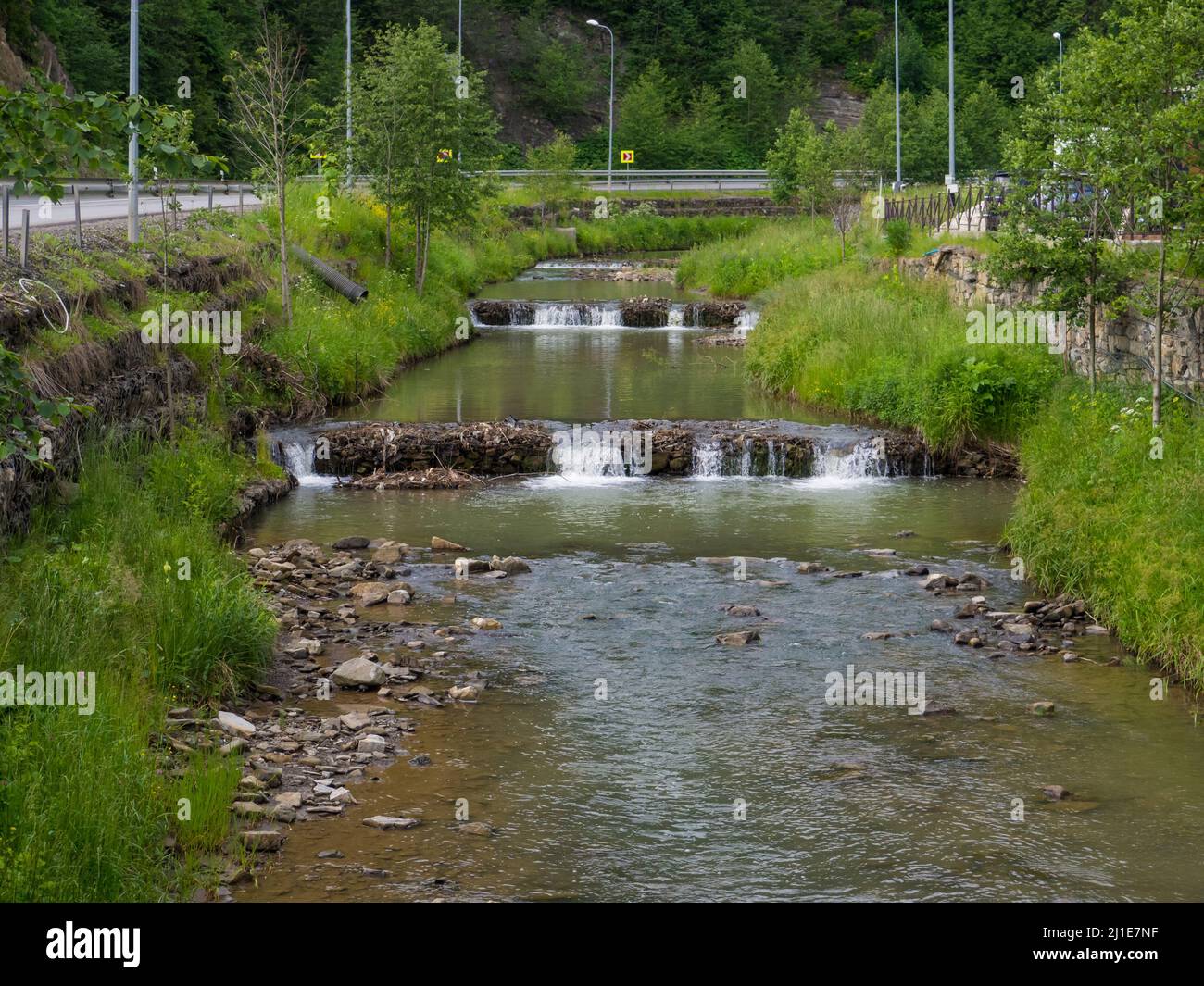 Small artificial river cascade with rocks Stock Photo - Alamy