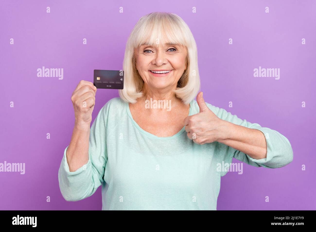 Photo of confident lady hold debit card raise thumb up positive ...