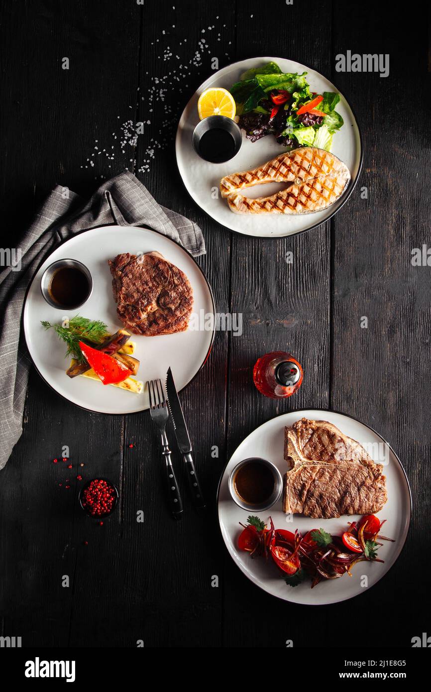 Top view on different grilled steaks Stock Photo - Alamy