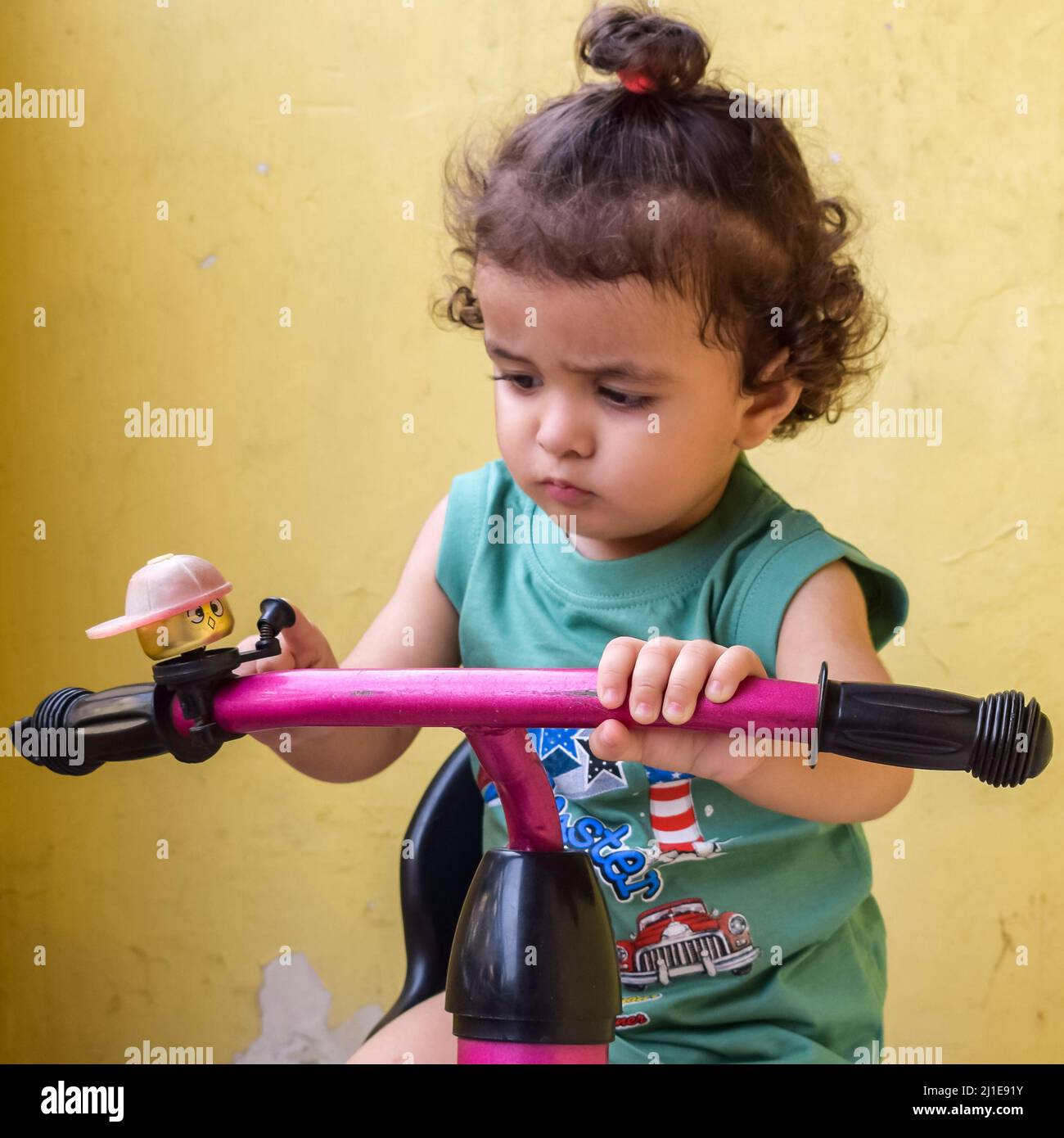 Cute little boy Shivaay driving cycle at home balcony during summer ...