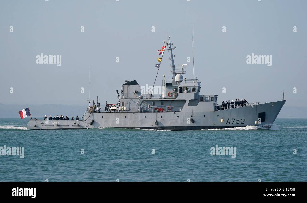 Members of the crew stand on the stern of the French navy Leopard-class ...
