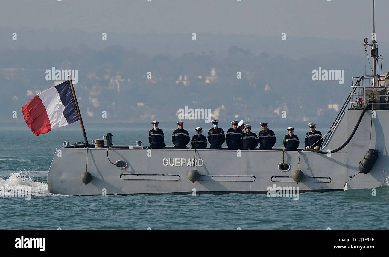 Members of the crew stand on the stern of the French navy Leopard-class ...