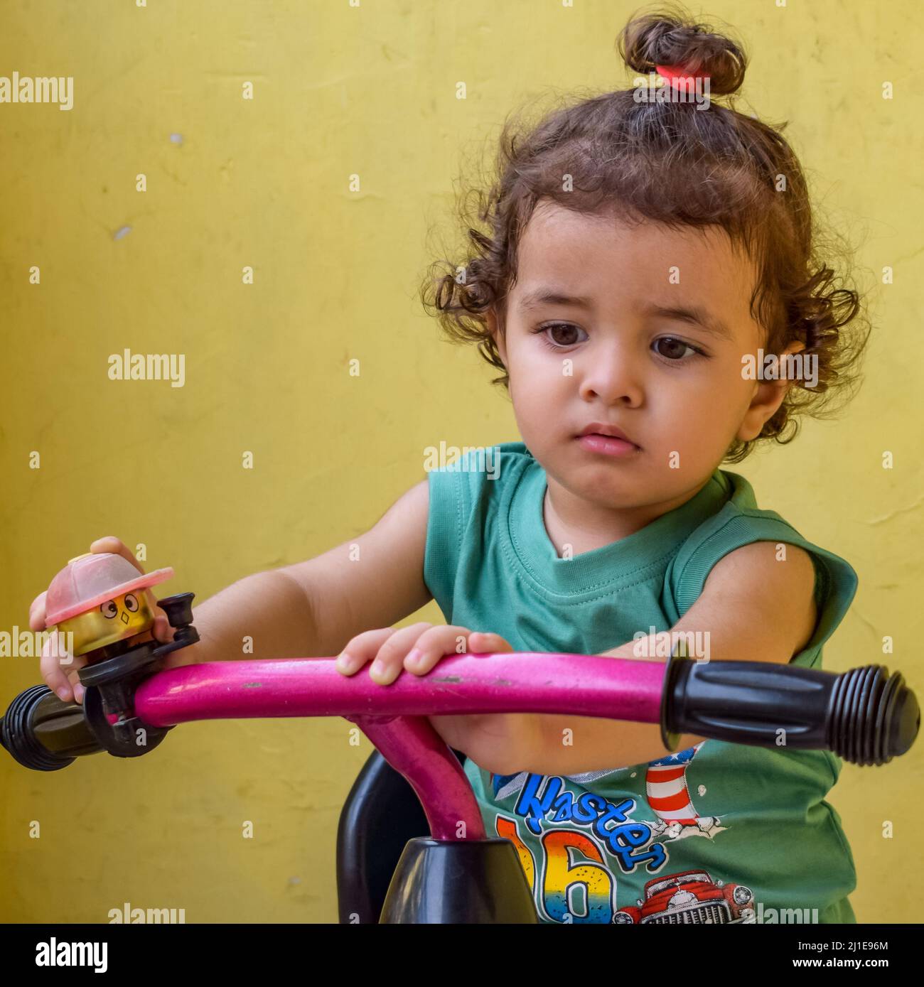 Cute little boy Shivaay driving cycle at home balcony during summer ...
