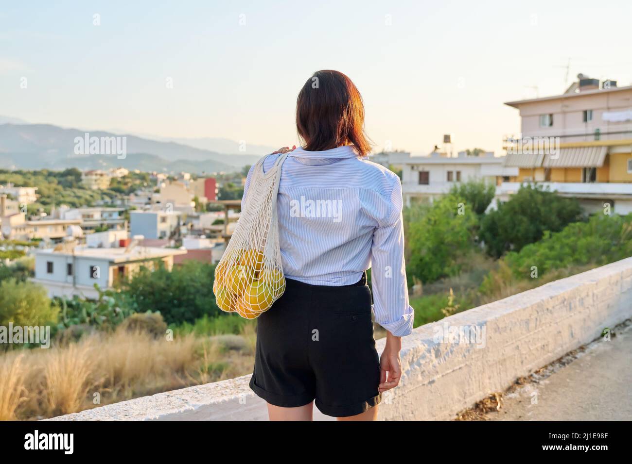 Eco tourism, woman walking relaxing in European mountain village Stock ...