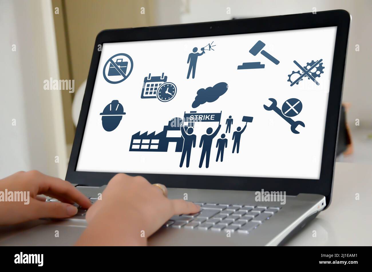 Hands on a laptop with screen showing strike concept Stock Photo - Alamy