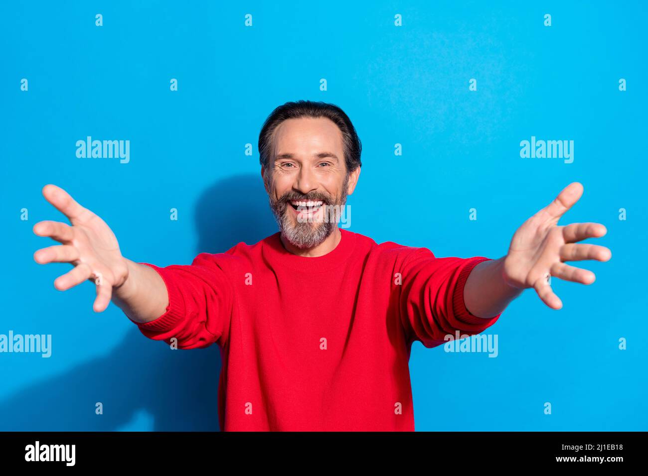 Portrait of attractive cheerful kind man hugging you welcome isolated ...