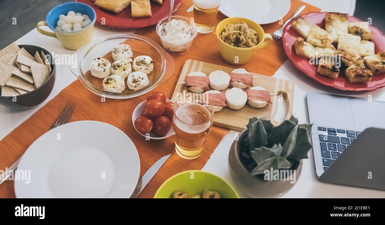 View from the top of a table with many foods ready for an aperitif with ...