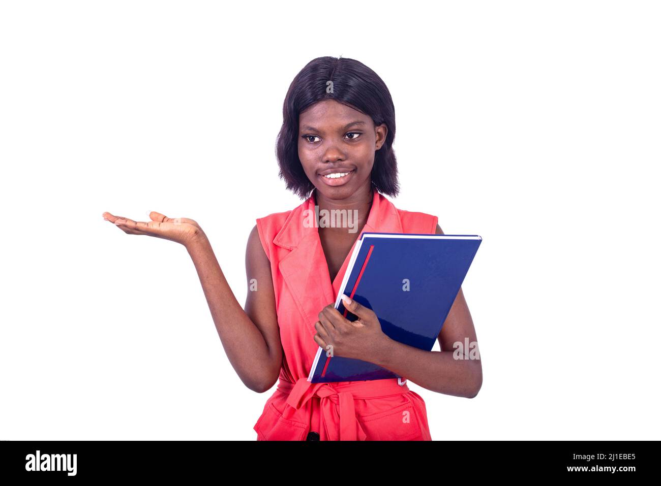 beautiful young teenage girl holding document and showing empty space ...