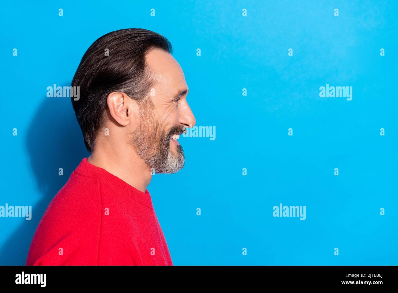 Profile side photo of relaxing mature guy looking empty space laughing ...