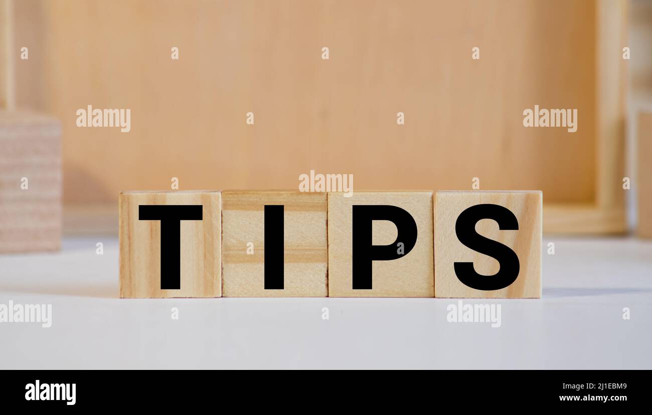 TIPS word written on wooden cubes, concept Stock Photo - Alamy