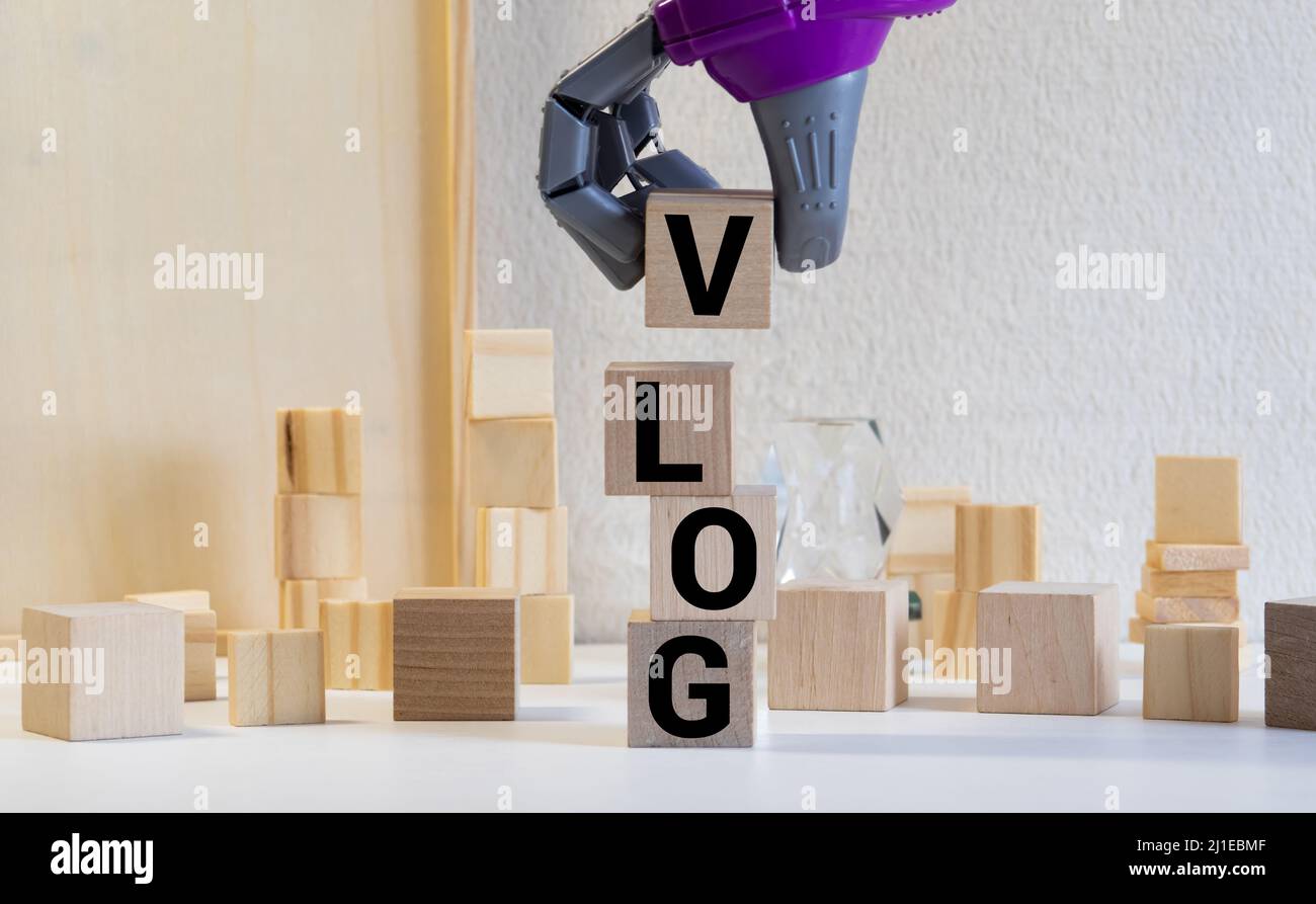 vlog - name from wooden letters. Office desk, informative and ...