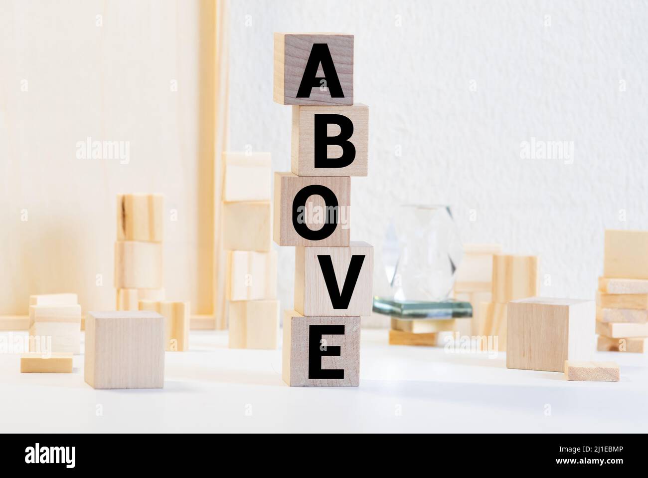 Wooden blocks with word ABOVE on dark background, above view Stock ...