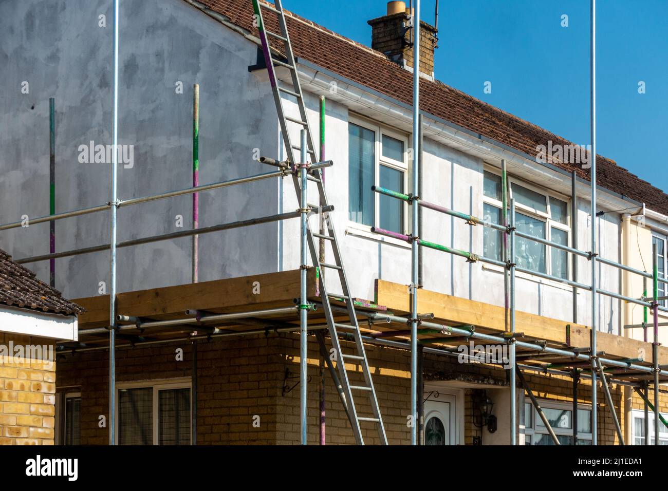 A house covered in scaffolding to allow easy and safe access for it's ...