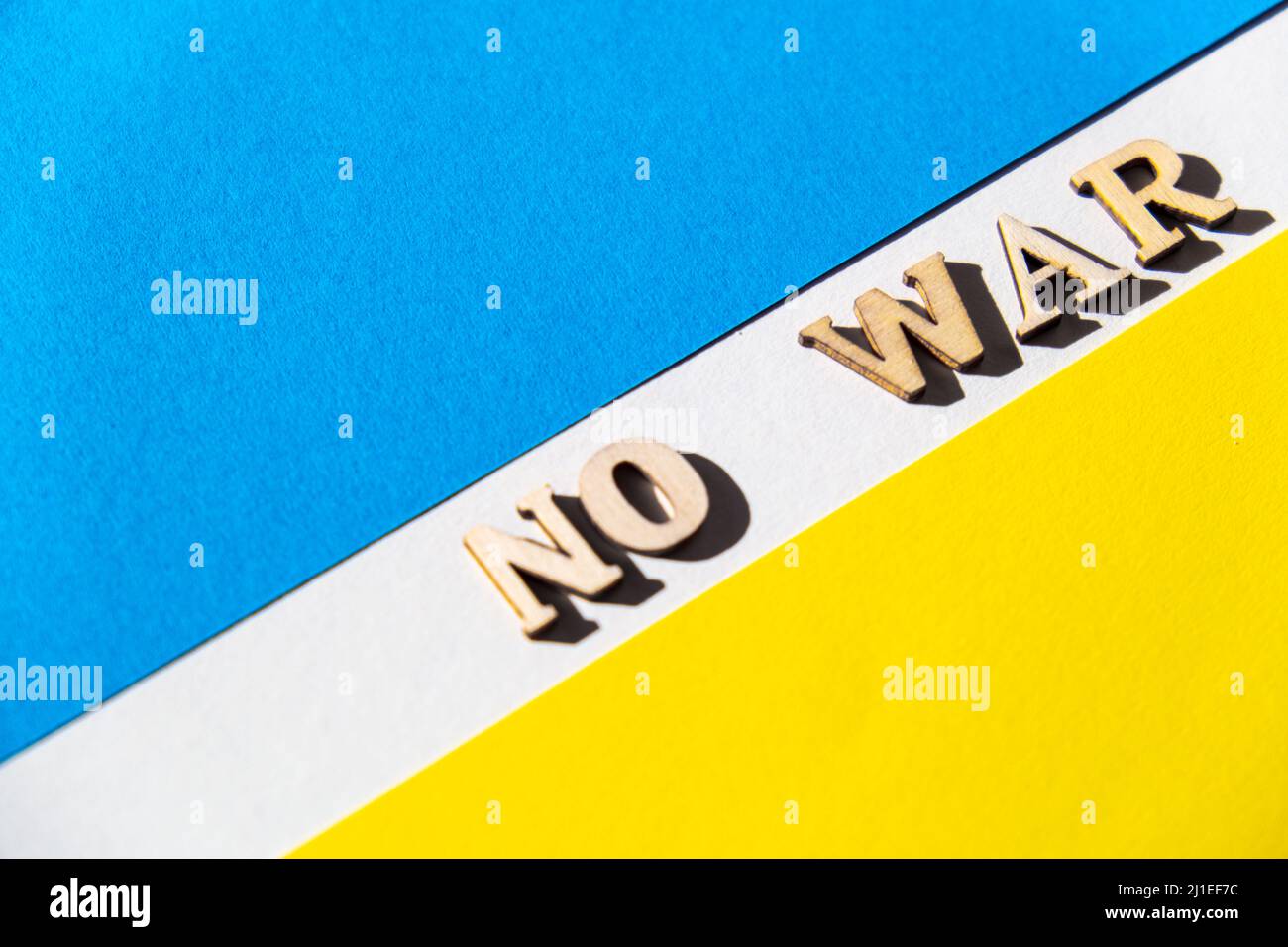 Ukrainian national flag made of paper. NO WAR text. Stop War. The ...