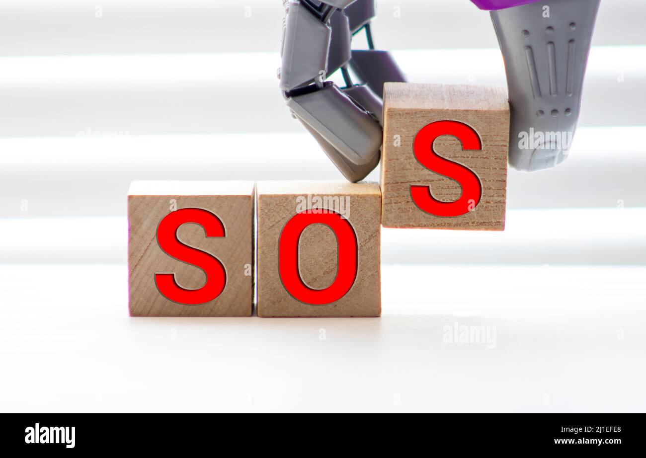 Wooden blocks forming the letters SOS isolated on white background ...