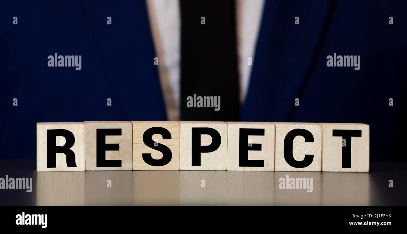 respect word written on wood block. respect text on table, concept ...