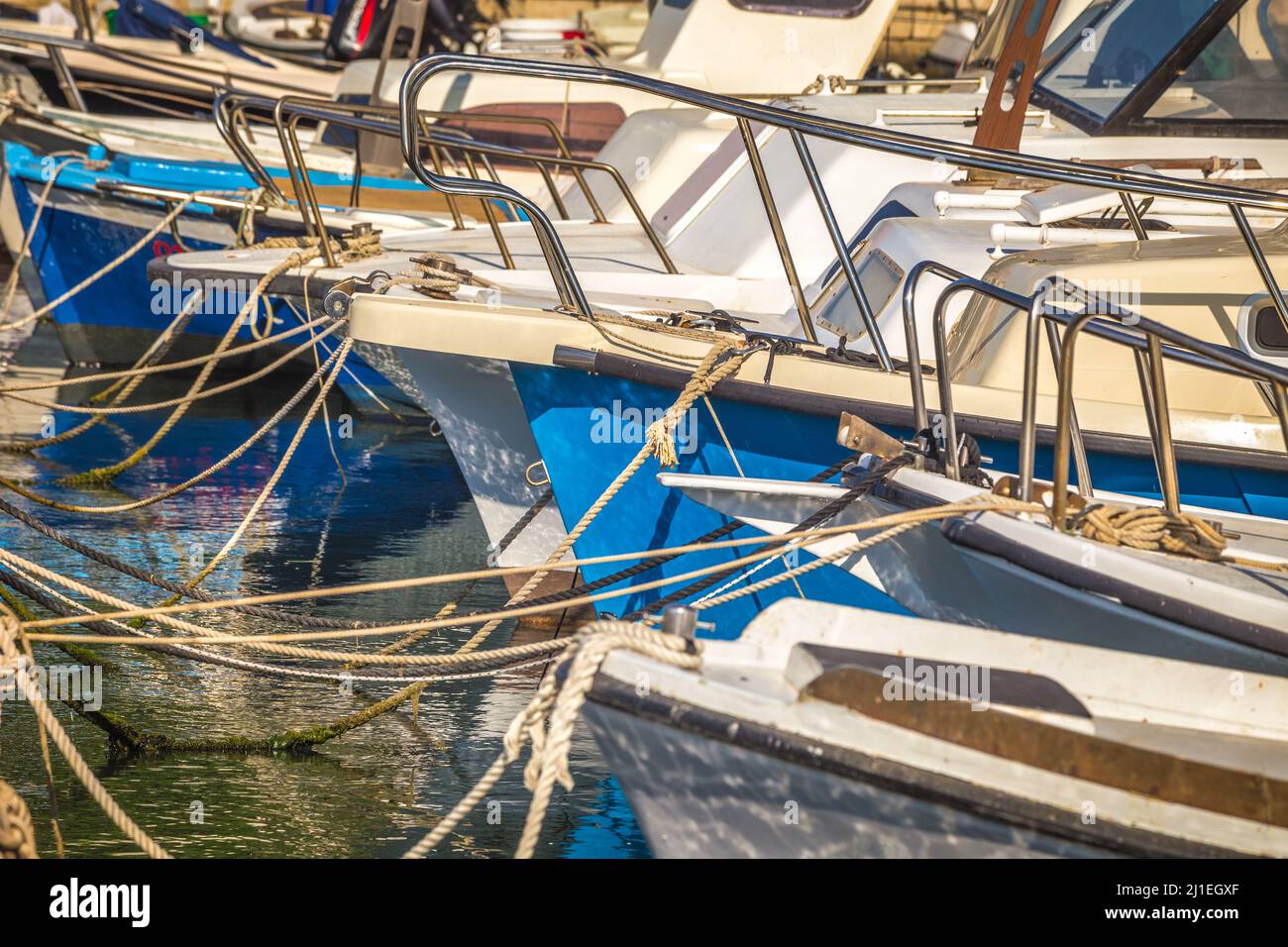 Detail of several ships anchored in a port at sea Stock Photo - Alamy