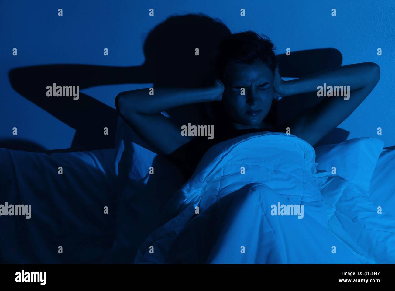 Woman with insomnia because of loud noises Stock Photo - Alamy