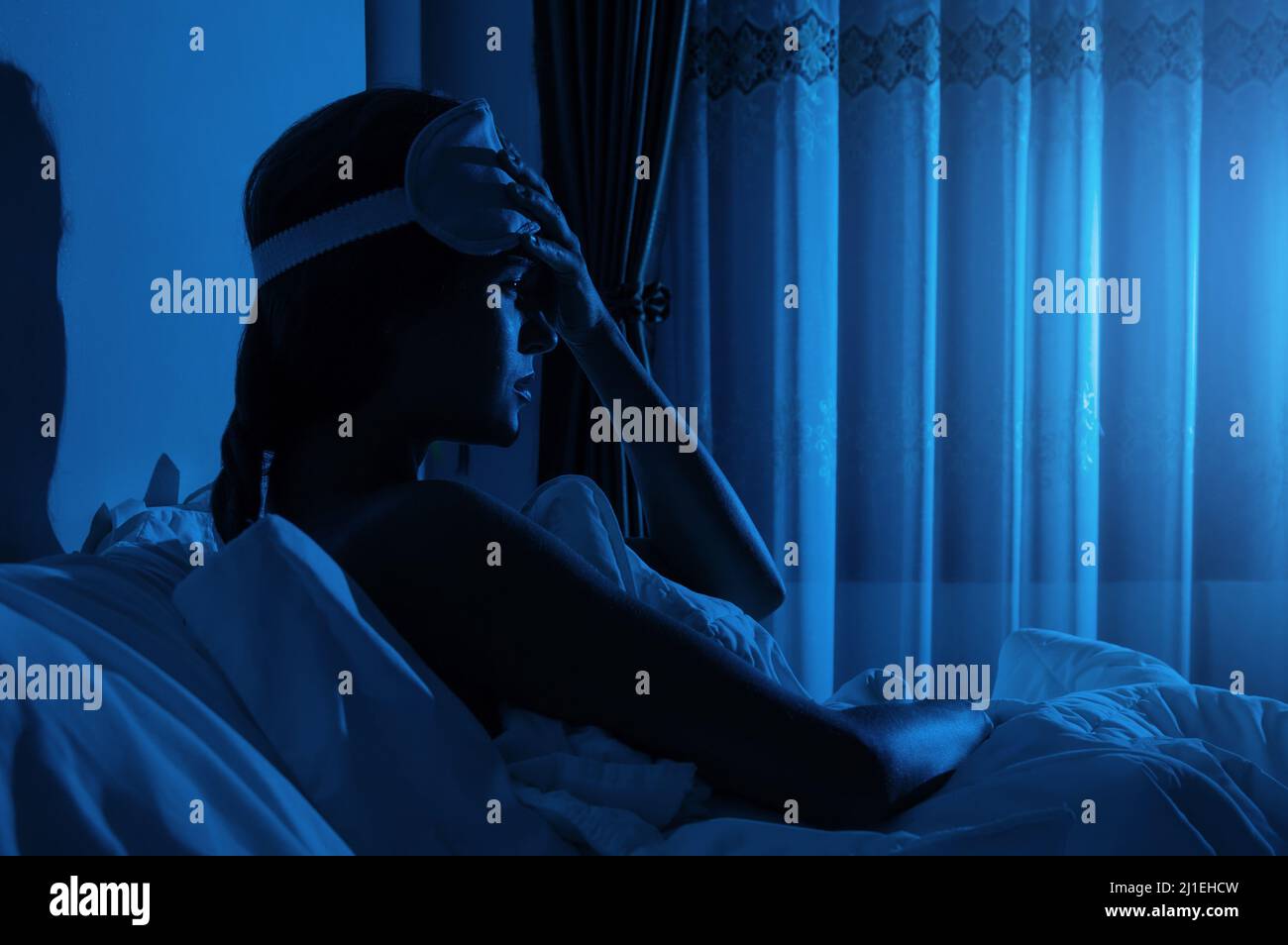 Young woman with a headache and insomnia Stock Photo - Alamy