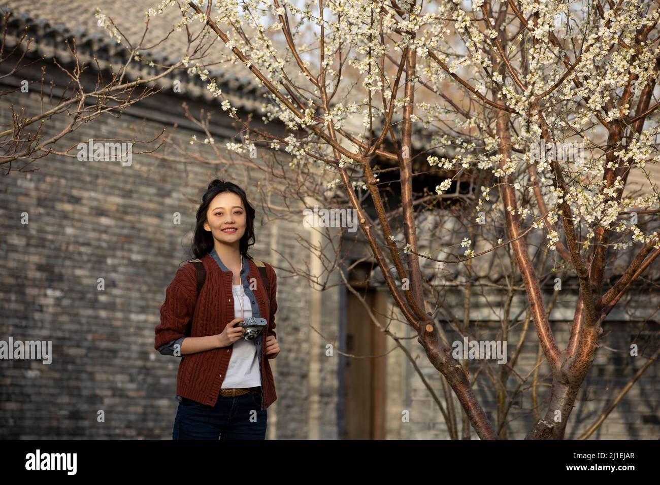 Young Chinese female college student outside a courtyard house - stock ...