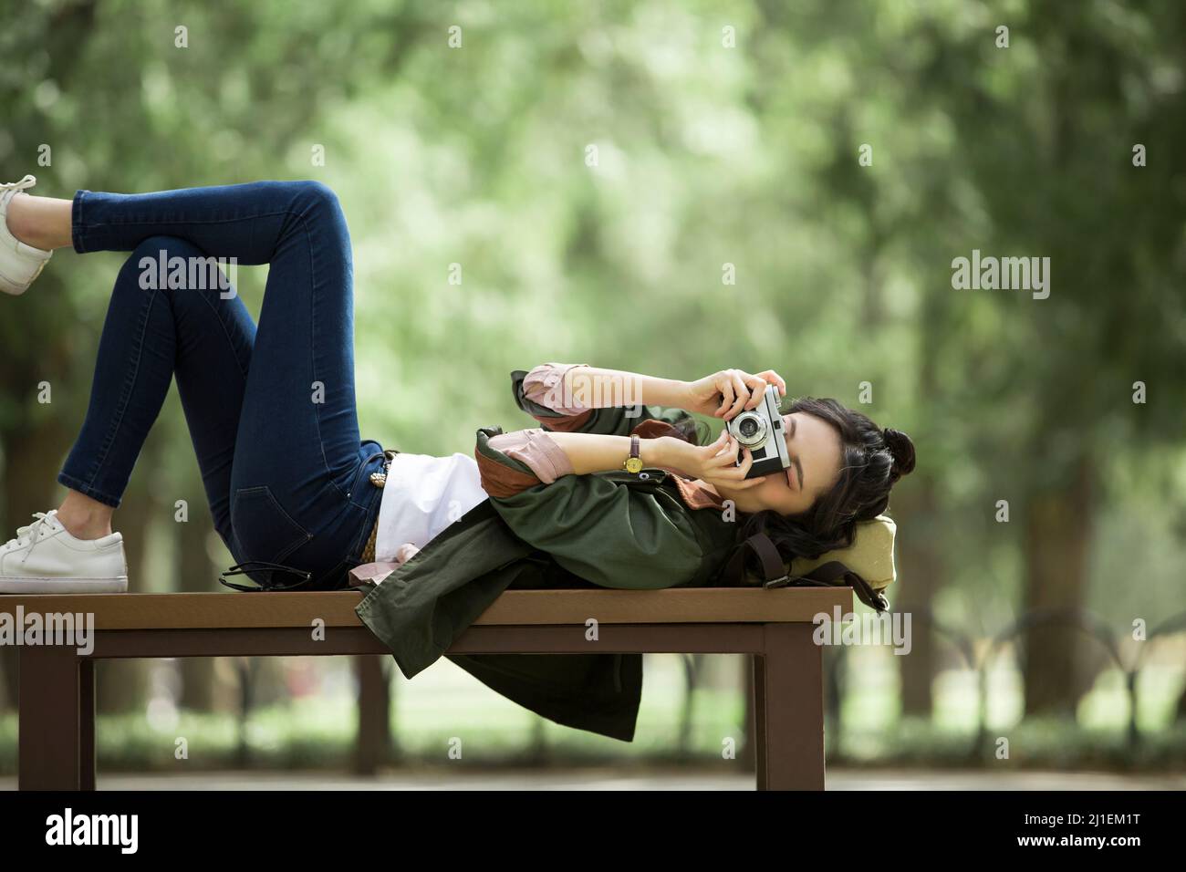 One woman lying on back legs up hi-res stock photography and images - Alamy