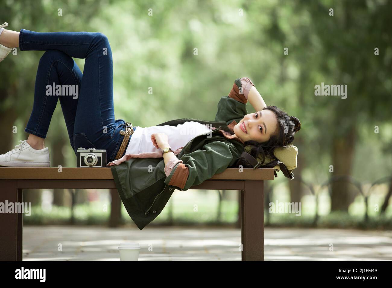 Woman lying on back legs up hi-res stock photography and images - Alamy