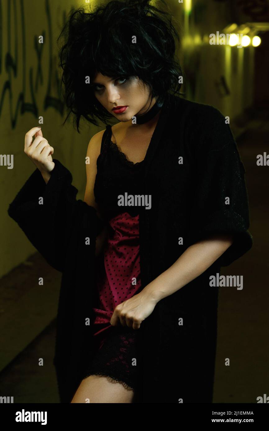 Strange and freaky woman in the dark tunnel Stock Photo - Alamy