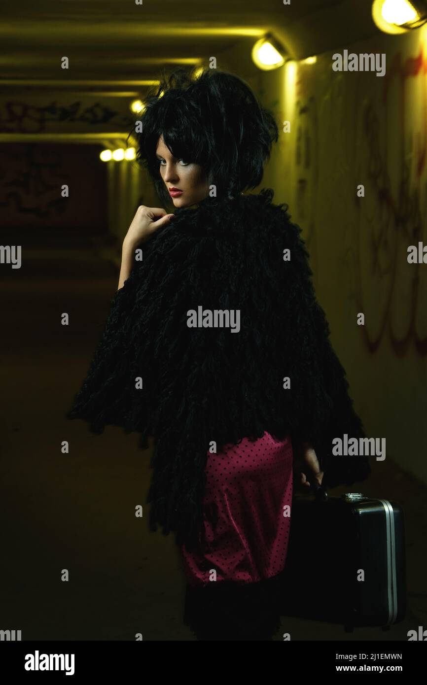 Strange and freaky woman in the dark tunnel Stock Photo - Alamy