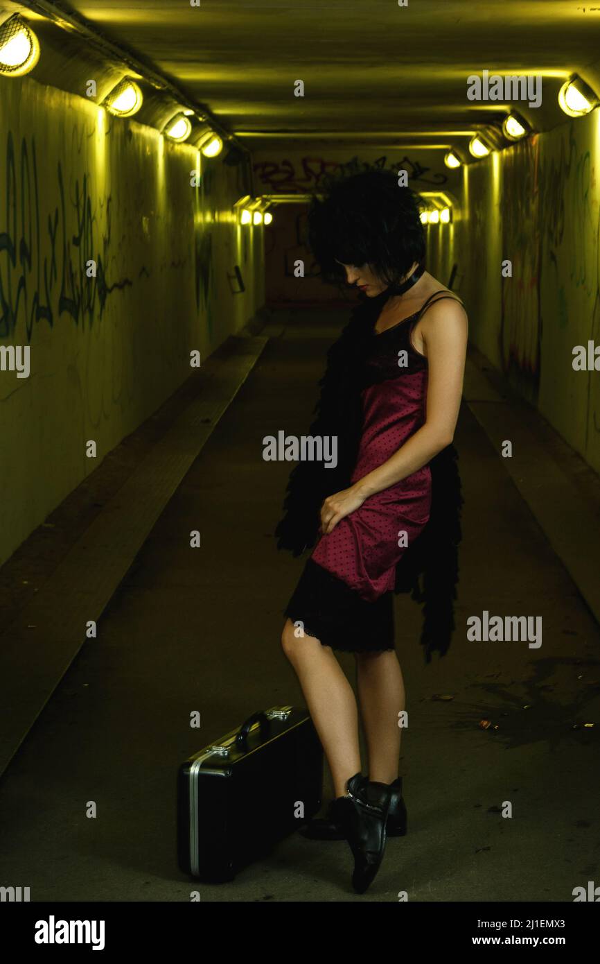 Strange and freaky woman in the dark tunnel Stock Photo - Alamy