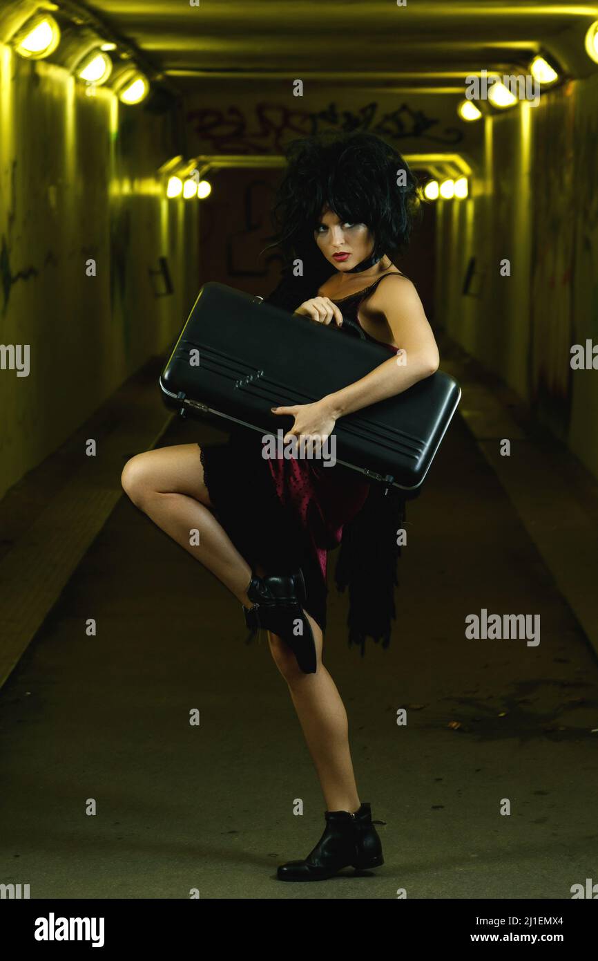 Strange and freaky woman in the dark tunnel Stock Photo - Alamy