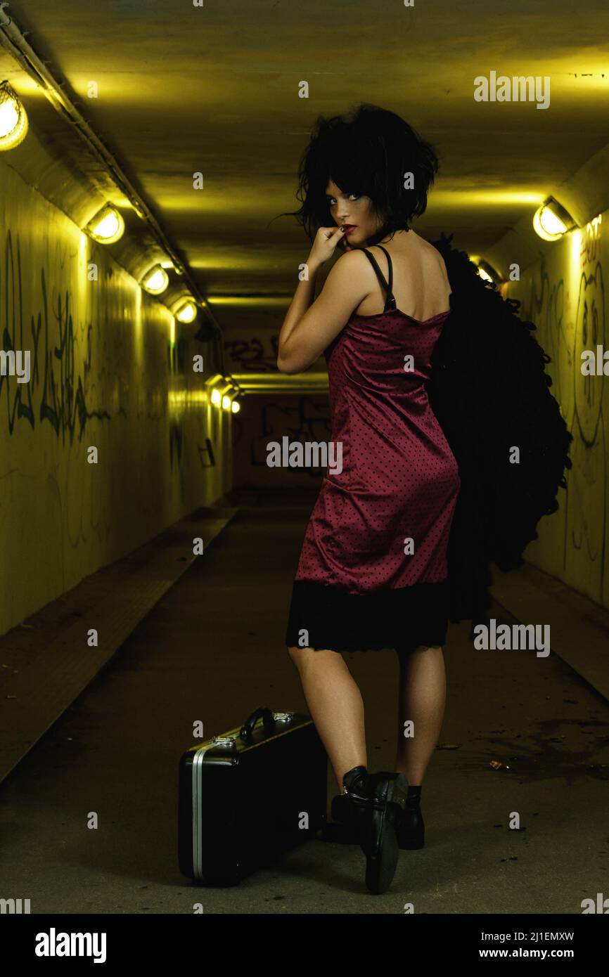 Strange and freaky woman in the dark tunnel Stock Photo - Alamy