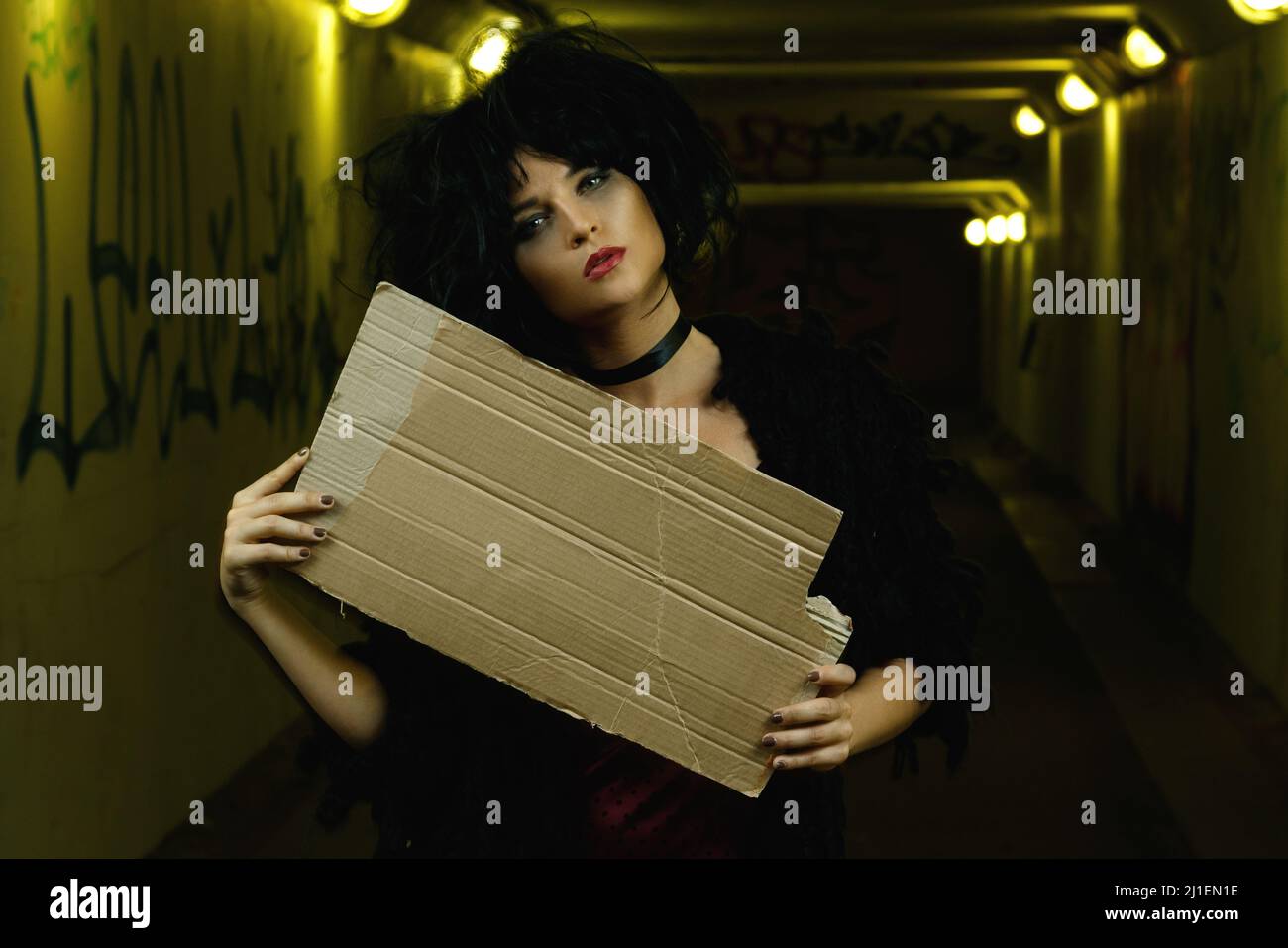 Strange and freaky woman with a piece of blank cardboard Stock Photo ...
