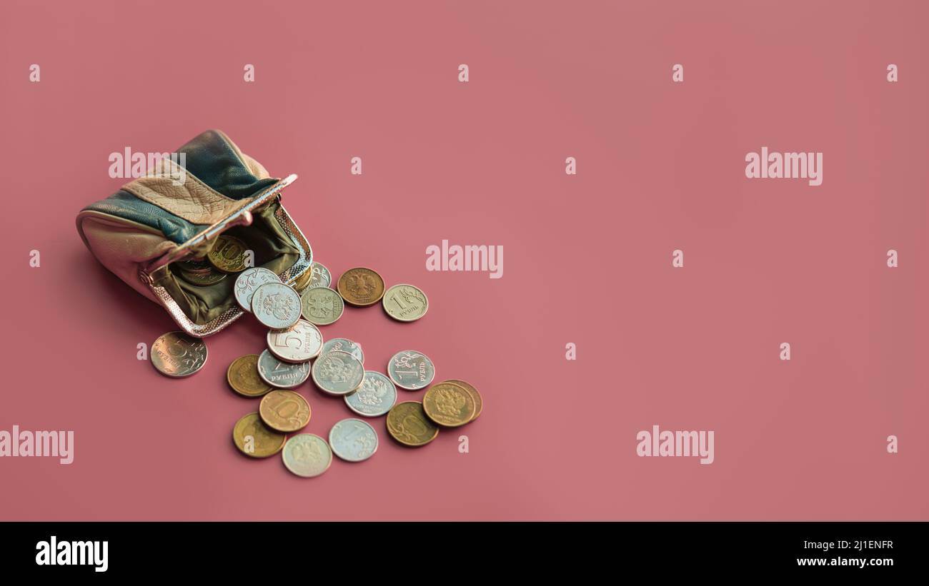 Copy space banner background of Ruble coins spilled out of small purse ...