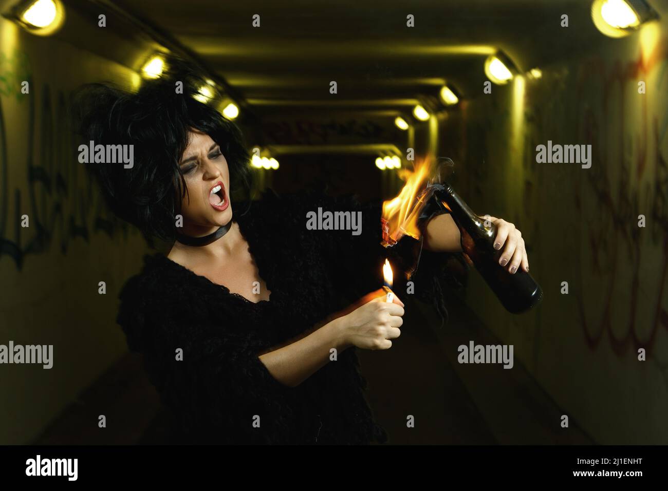 Freaky woman with a petrol bomb in her hands Stock Photo - Alamy