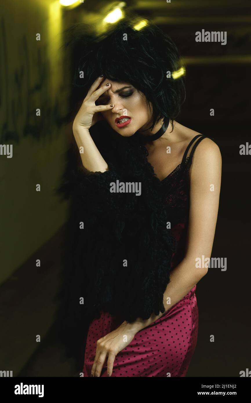 Strange and freaky woman in the dark tunnel Stock Photo - Alamy