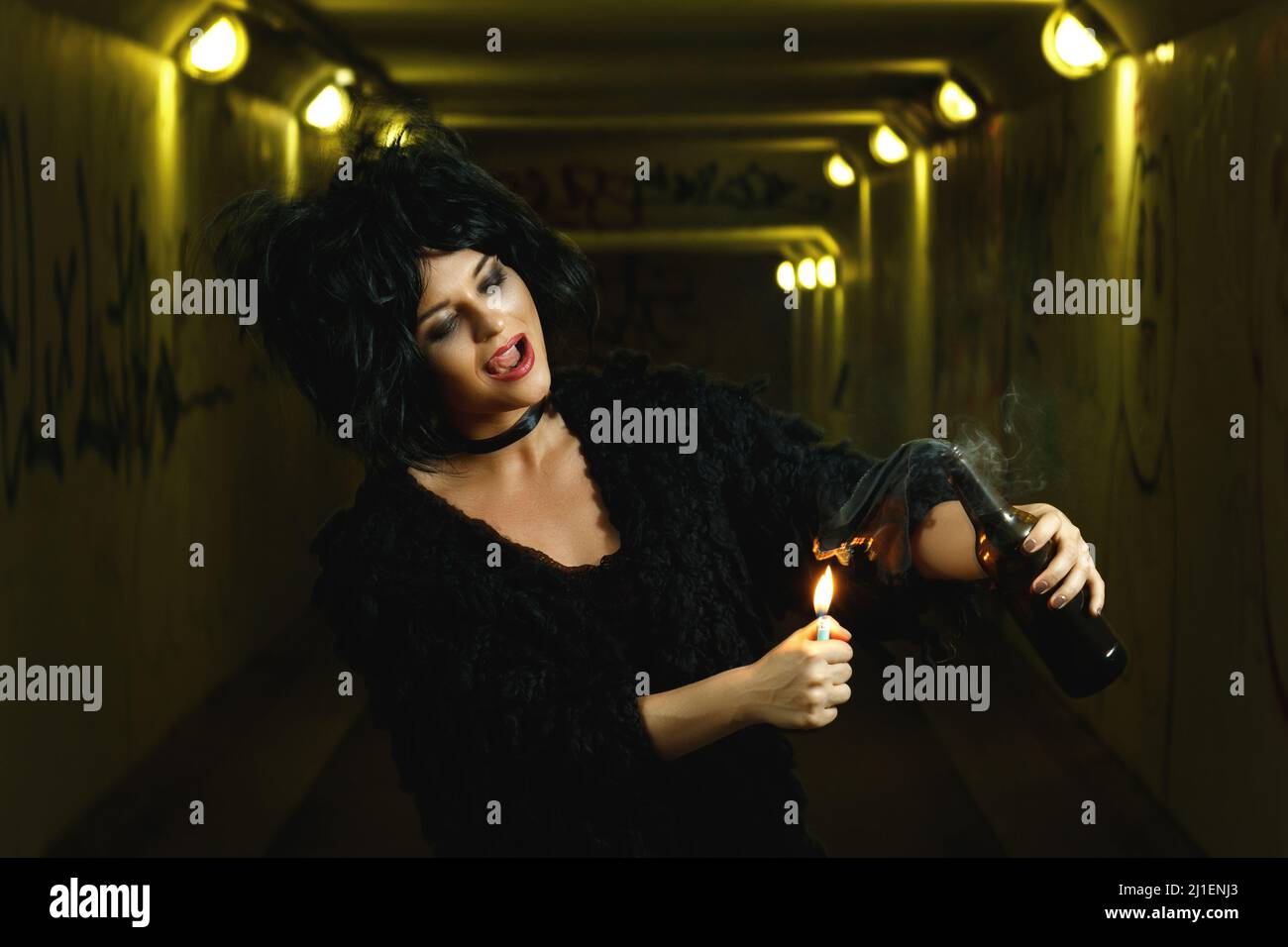 Freaky woman with a petrol bomb in her hands Stock Photo - Alamy