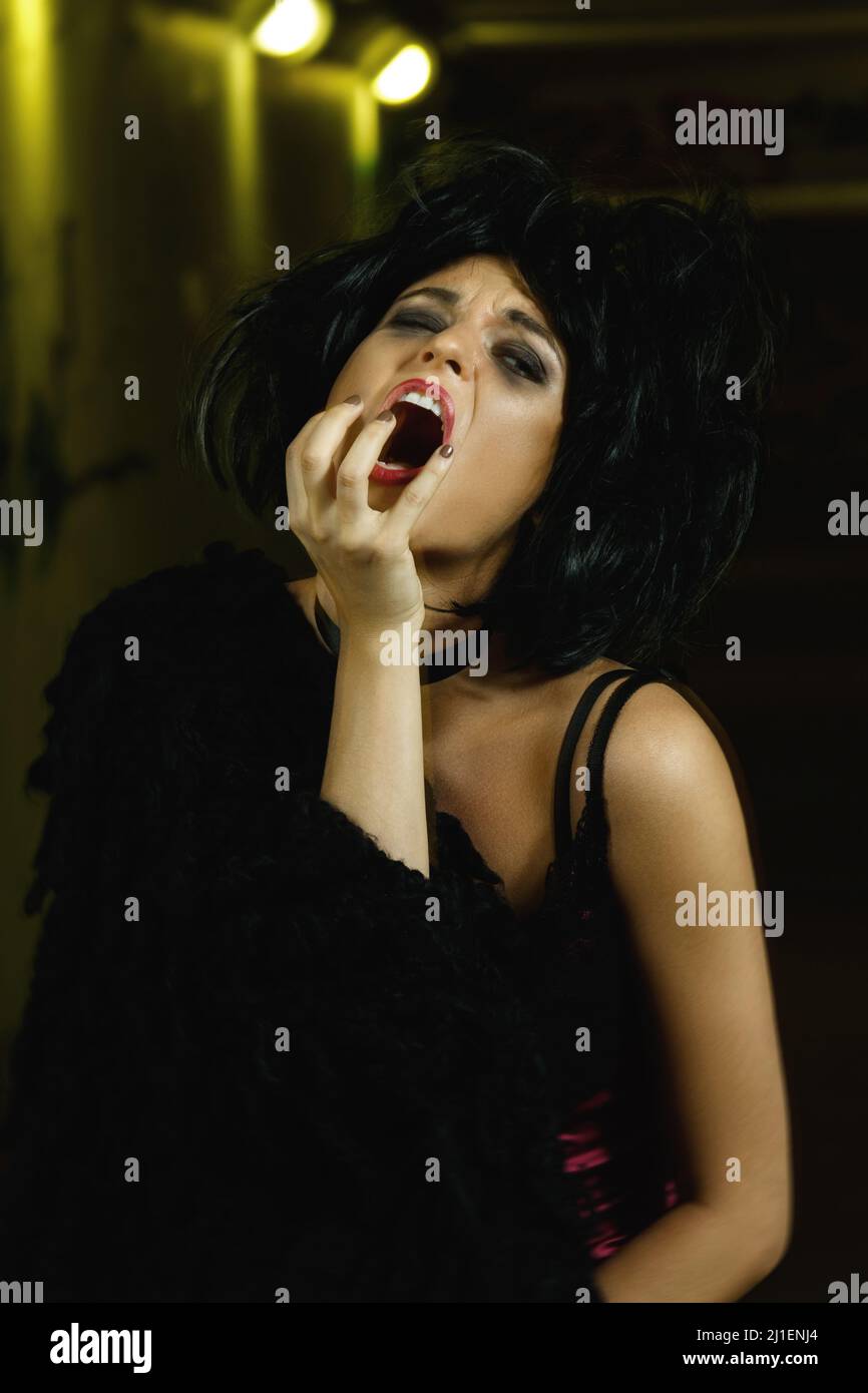 Strange and freaky woman in the dark tunnel Stock Photo - Alamy