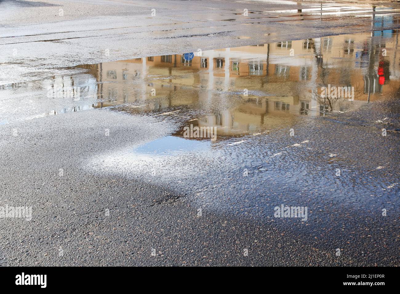 Reflection of the city in a puddle on the pavement Stock Photo - Alamy