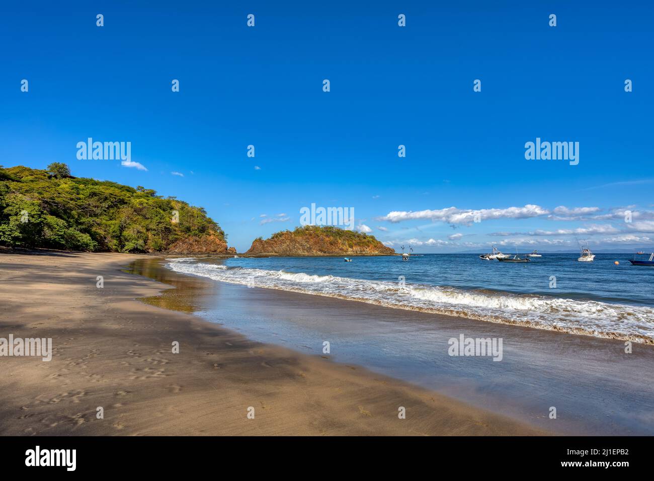 Playa Ocotal with Pacific ocean waves on rocky shore, El Coco Costa ...