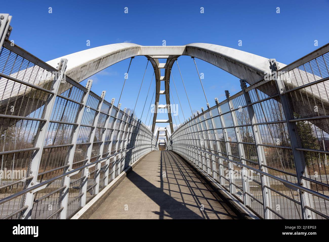 Pedestrian bridge across Trans Canada Highway in modern city suburbs ...