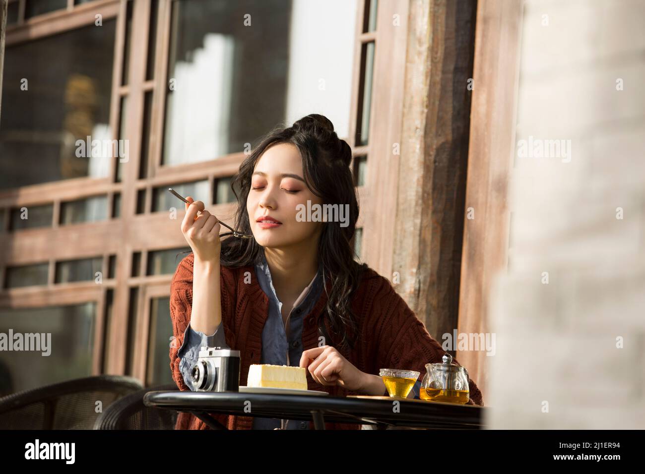 Woman enjoying afternoon tea hi-res stock photography and images - Alamy