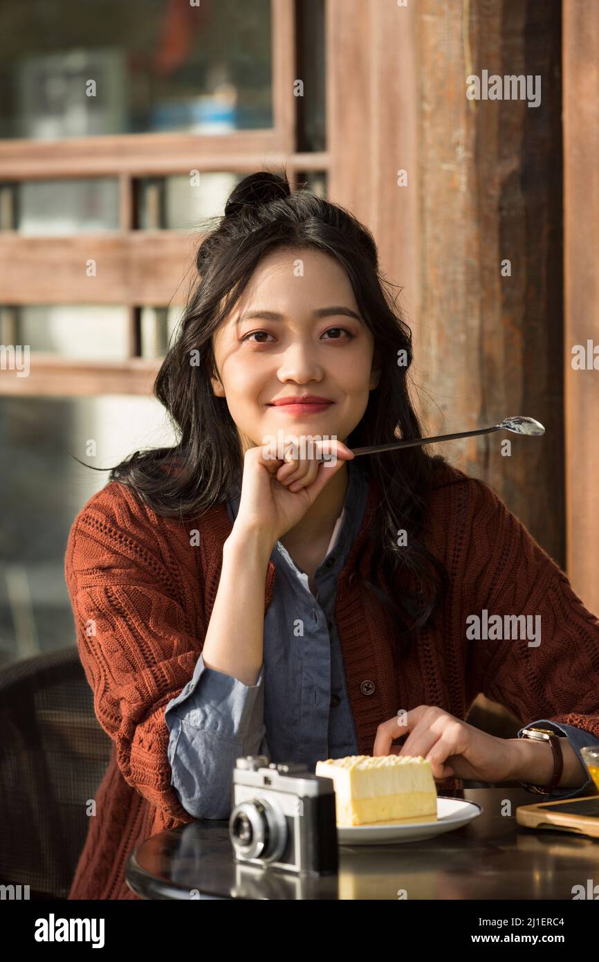 Woman enjoying afternoon tea hi-res stock photography and images - Alamy