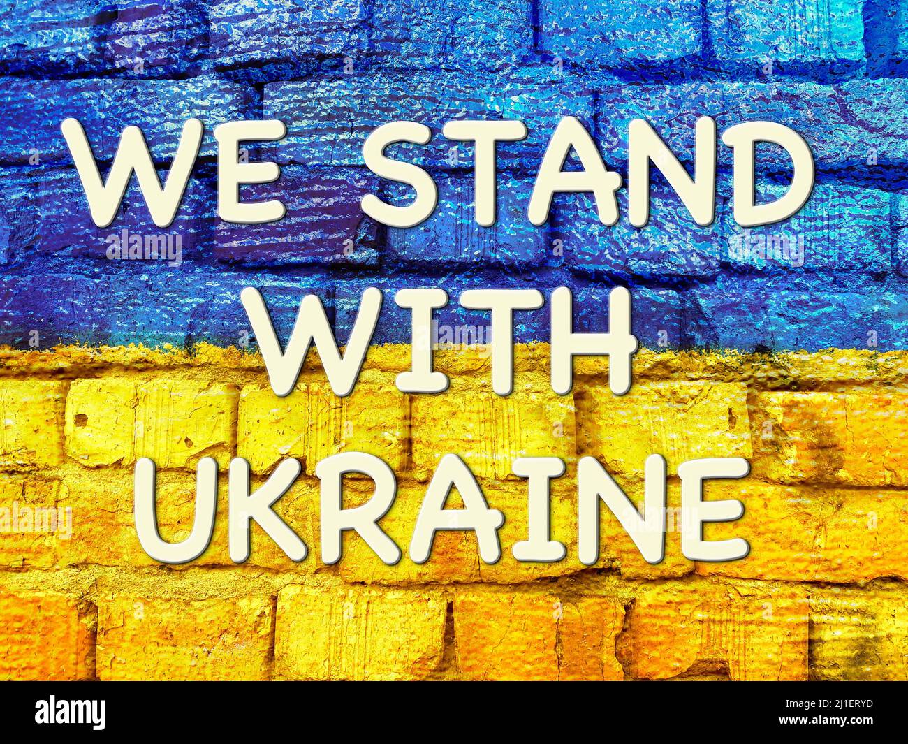 message We stand with Ukraine on Ukrainian flag painted on brick wall ...