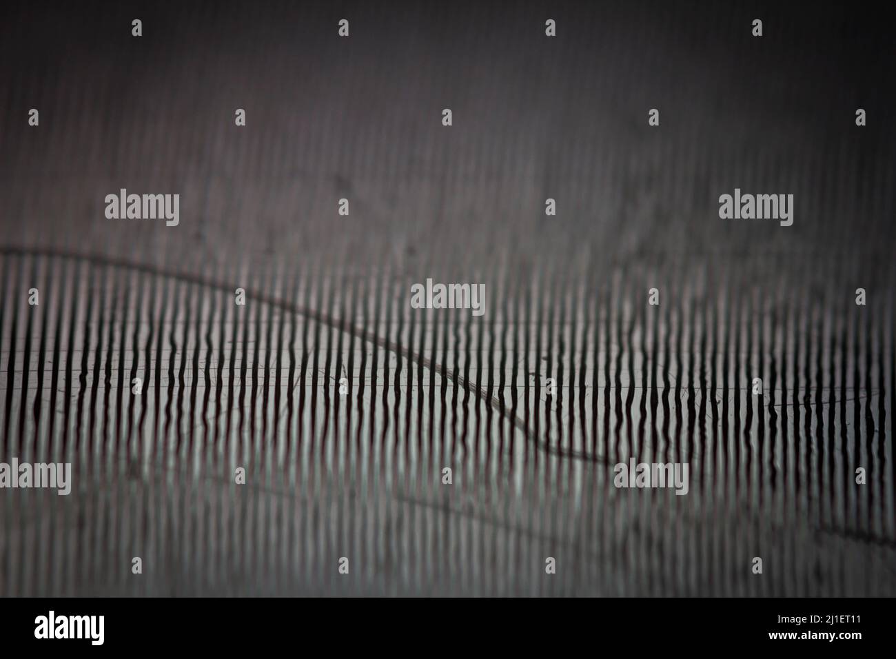 Macro shot of black vinyl record showing scratches. Surface of an old ...
