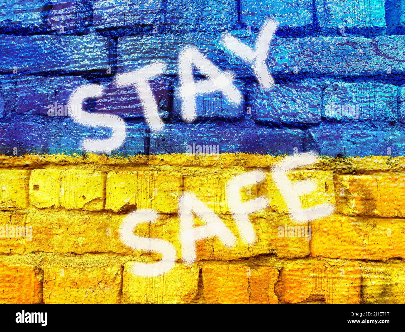 slogan Stay Safe on Ukrainian flag painted on brick wall Stock Photo ...