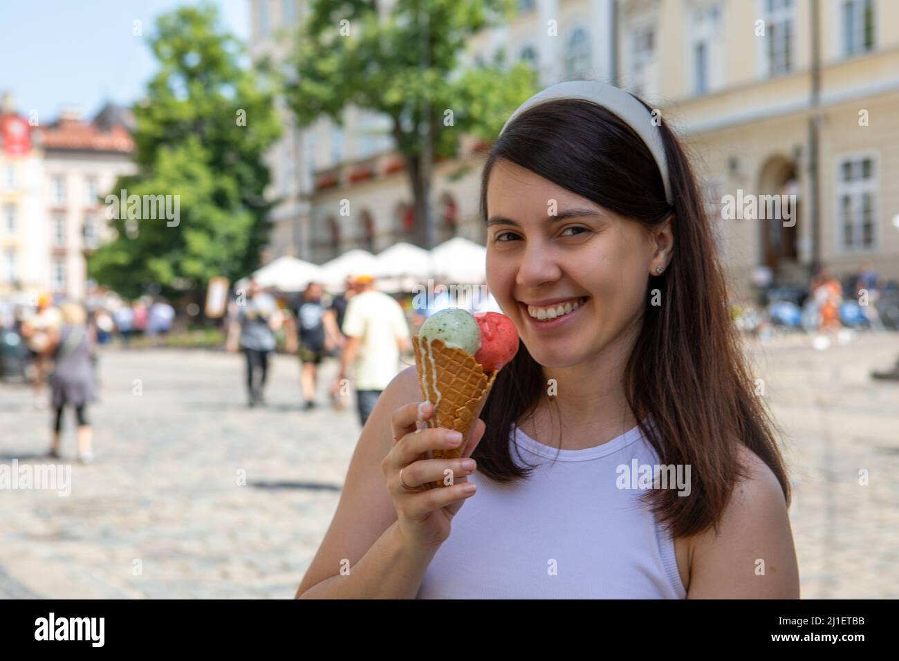 happy woman portrait eating ice cream at hot summer day outdoors Stock ...