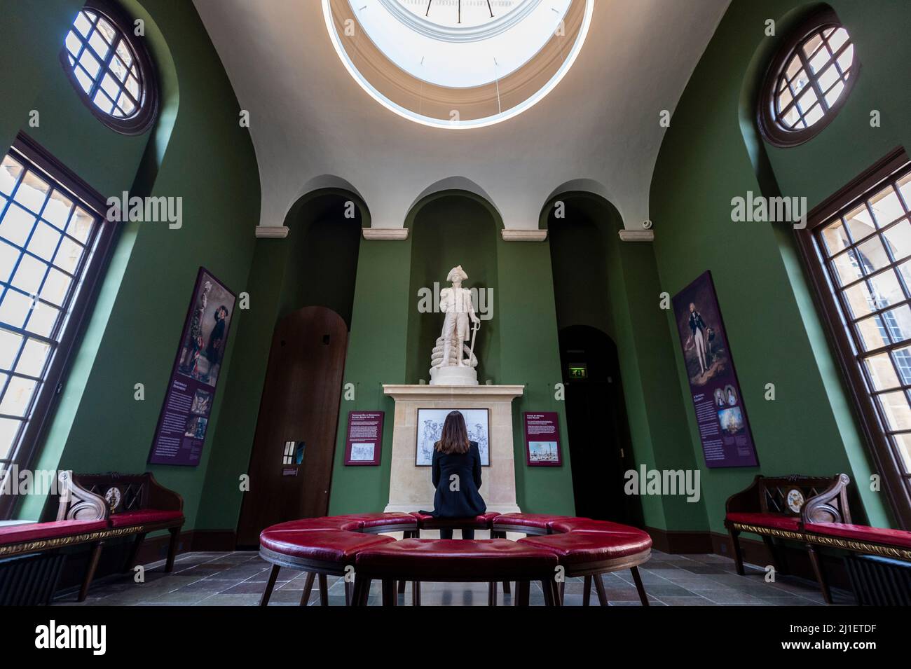 London, UK. 25th Mar, 2022. A staff member poses in the Nelson Room at ...